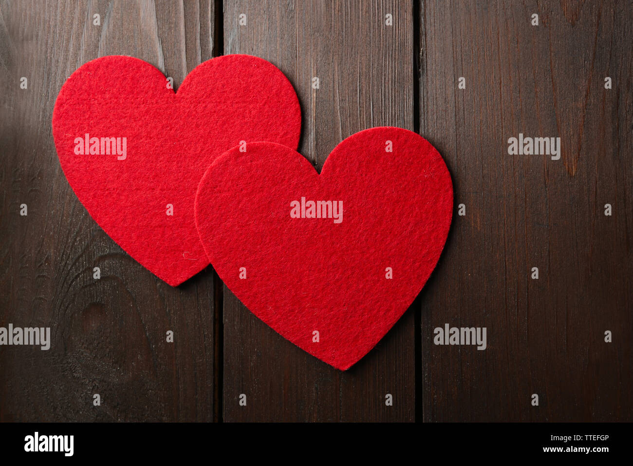 Beautiful romantic hearts on wooden background Stock Photo - Alamy