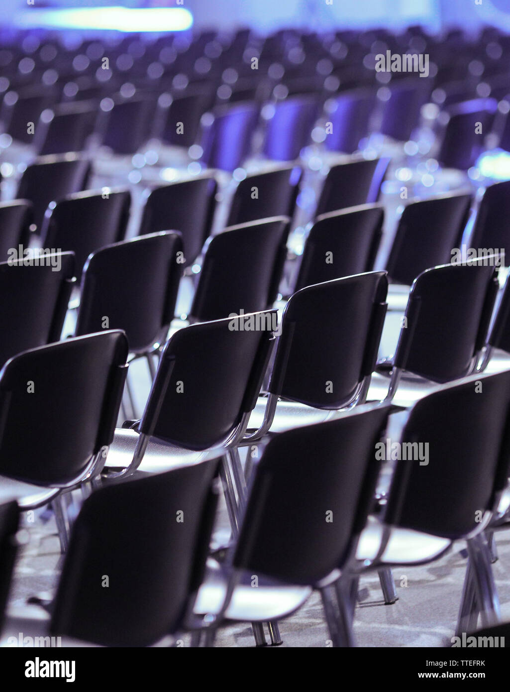 Rows of empty plastic seats in an empty conference room - no people ...