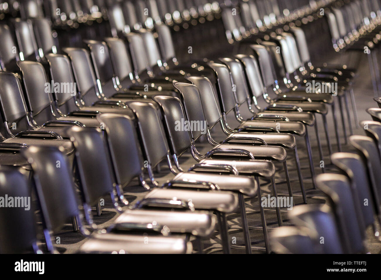 Rows of empty plastic seats in an empty conference room - no people ...