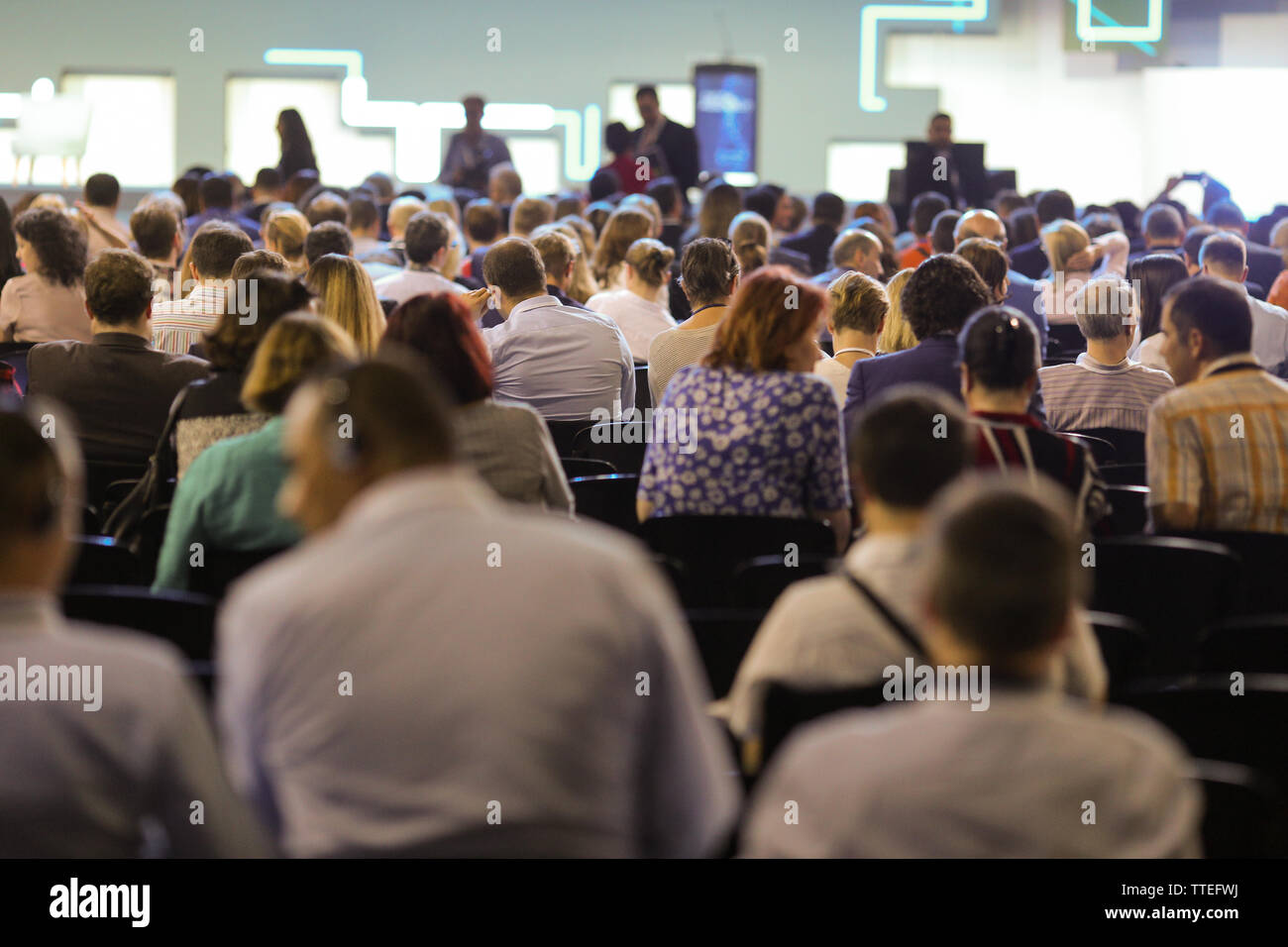 People attend a conference in a big hall Stock Photo - Alamy