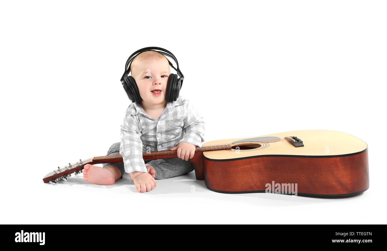 Cute baby with guitar and headphones isolated on white background Stock ...