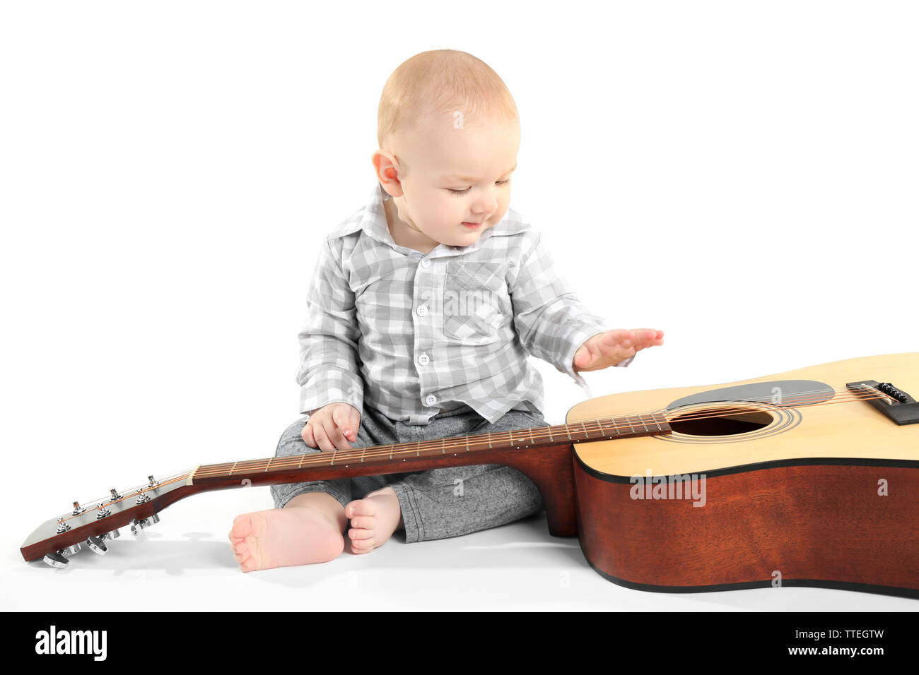 Cute baby with guitar isolated on white background Stock Photo - Alamy