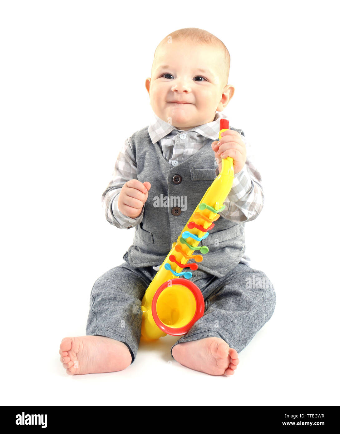 Adorable baby with plastic colourful saxophone isolated on white ...