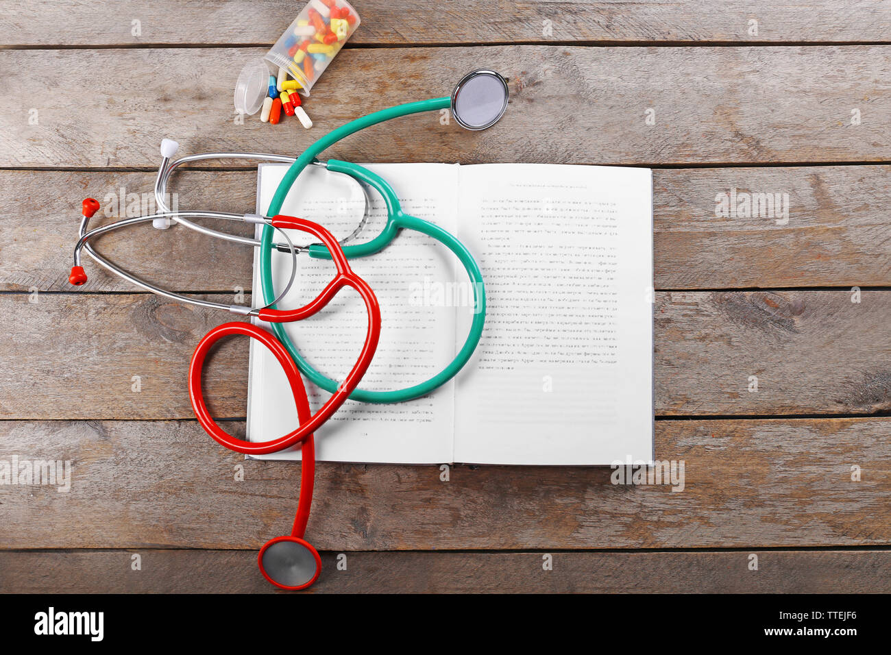 Stethoscopes on a book Stock Photo - Alamy