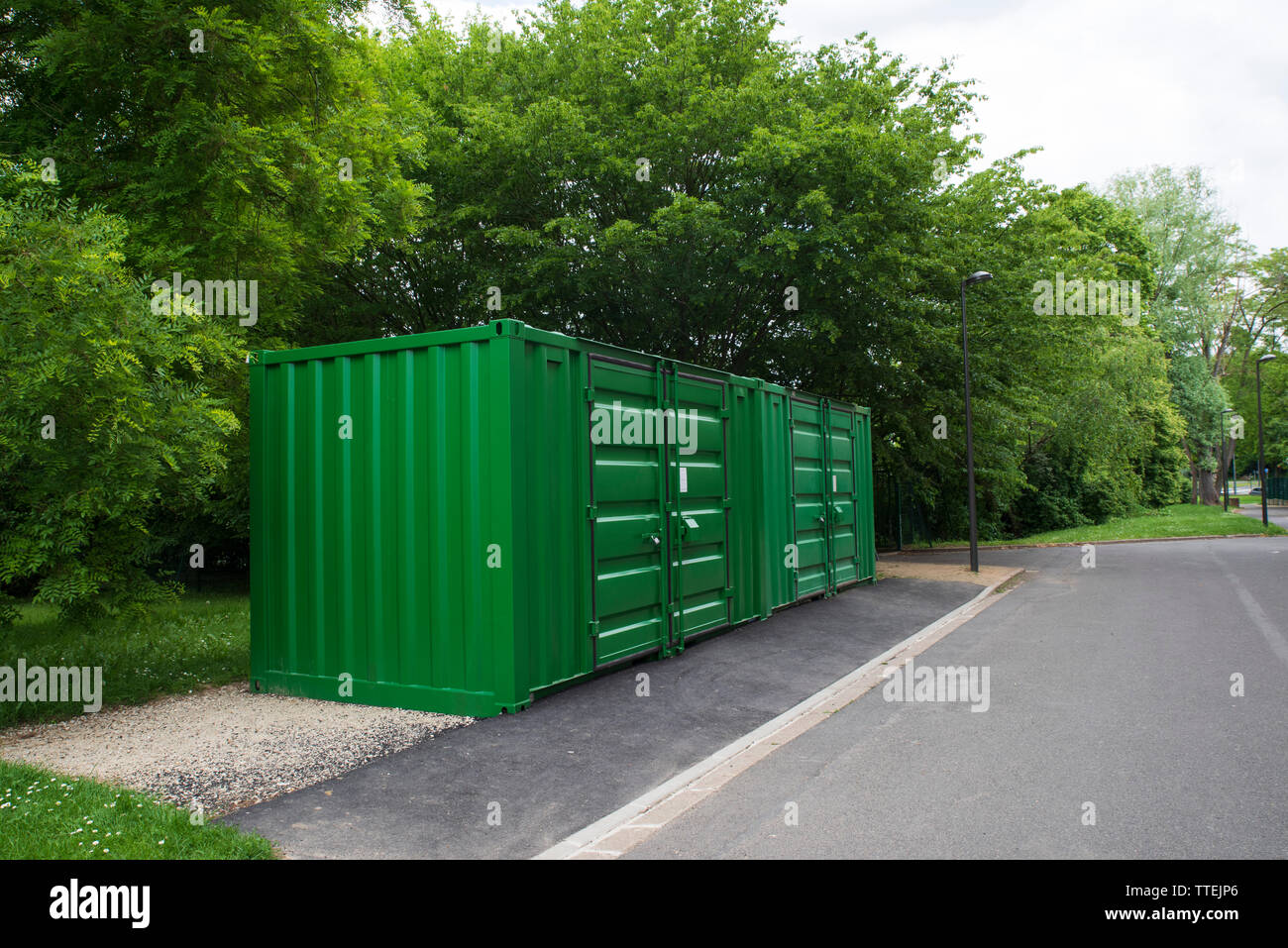 Containers on a roadside in the city Stock Photo - Alamy