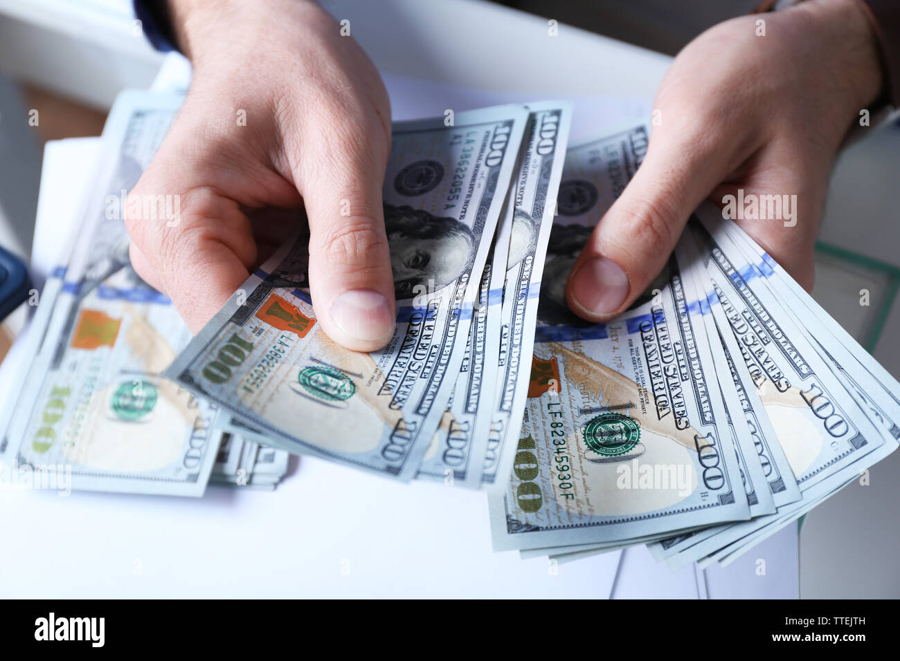 Hands counting money, close up Stock Photo - Alamy