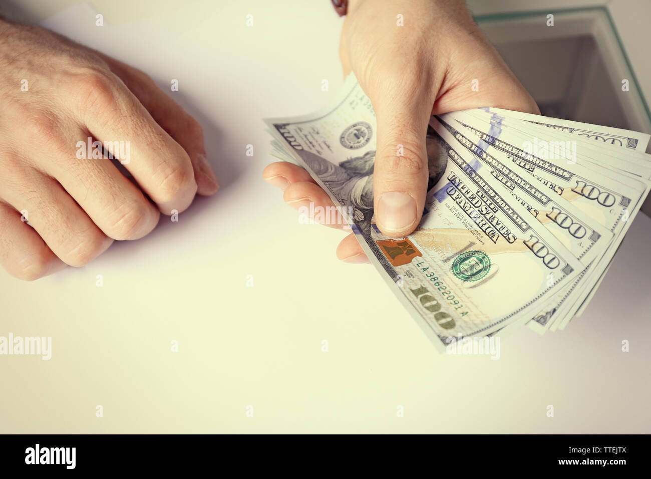 Hands counting money, close up Stock Photo - Alamy