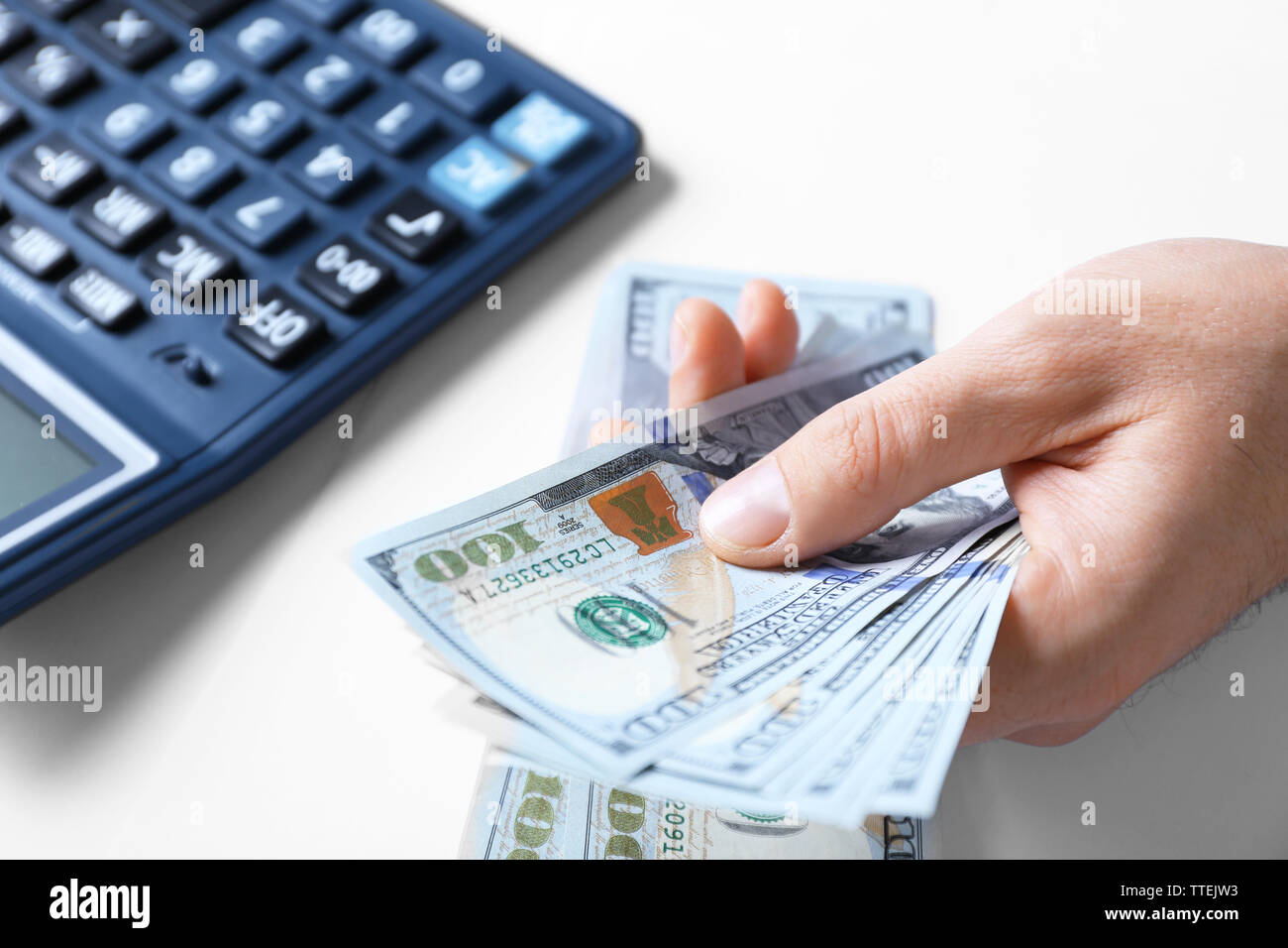 Hands counting money, close up Stock Photo - Alamy