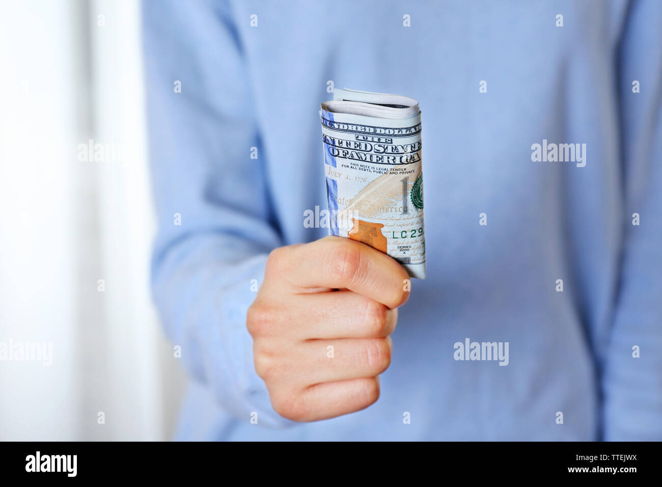 Man holds pile cash hand hi-res stock photography and images - Alamy