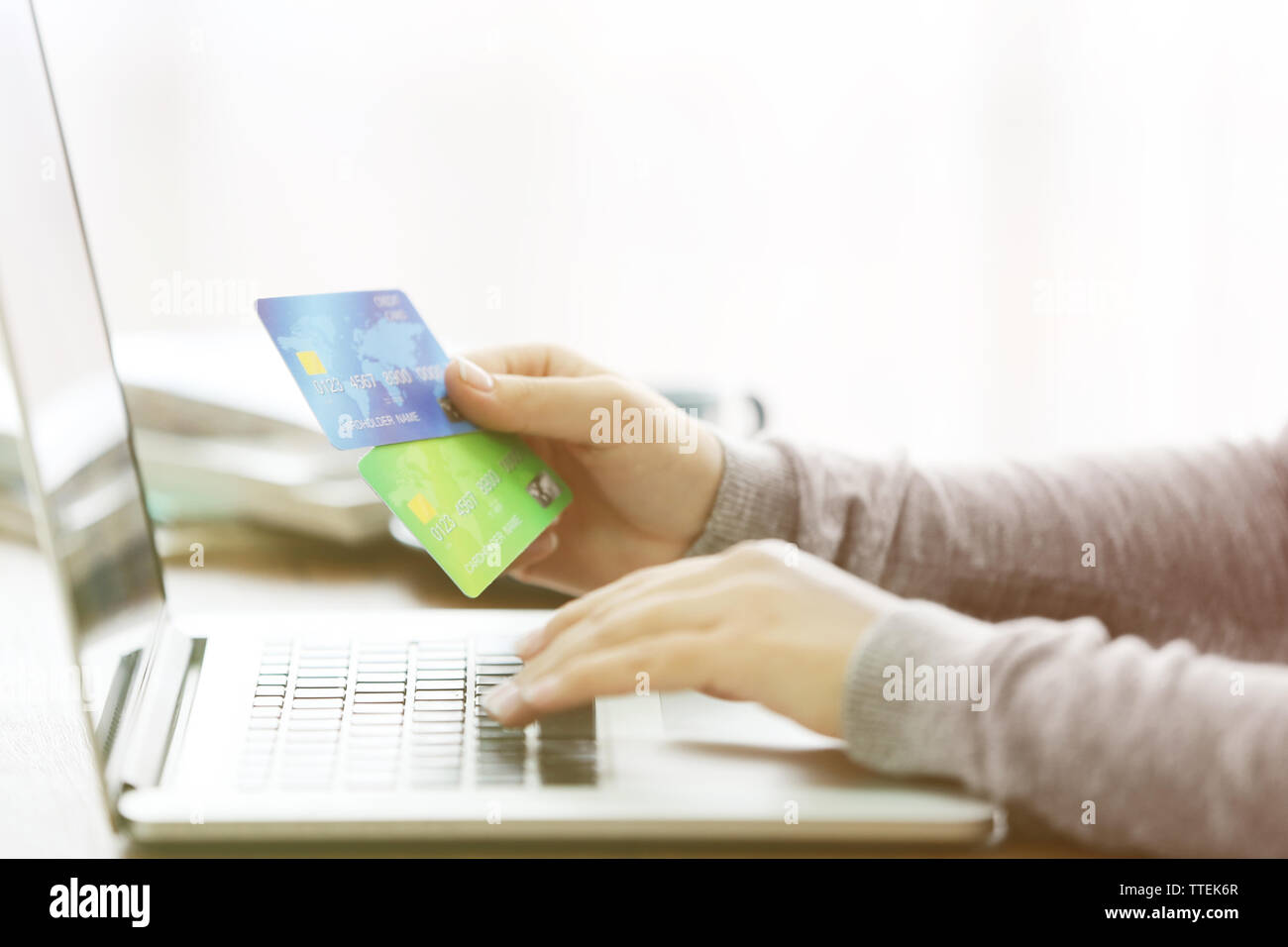 E-commerce concept. Woman with credit card and laptop, close up Stock ...