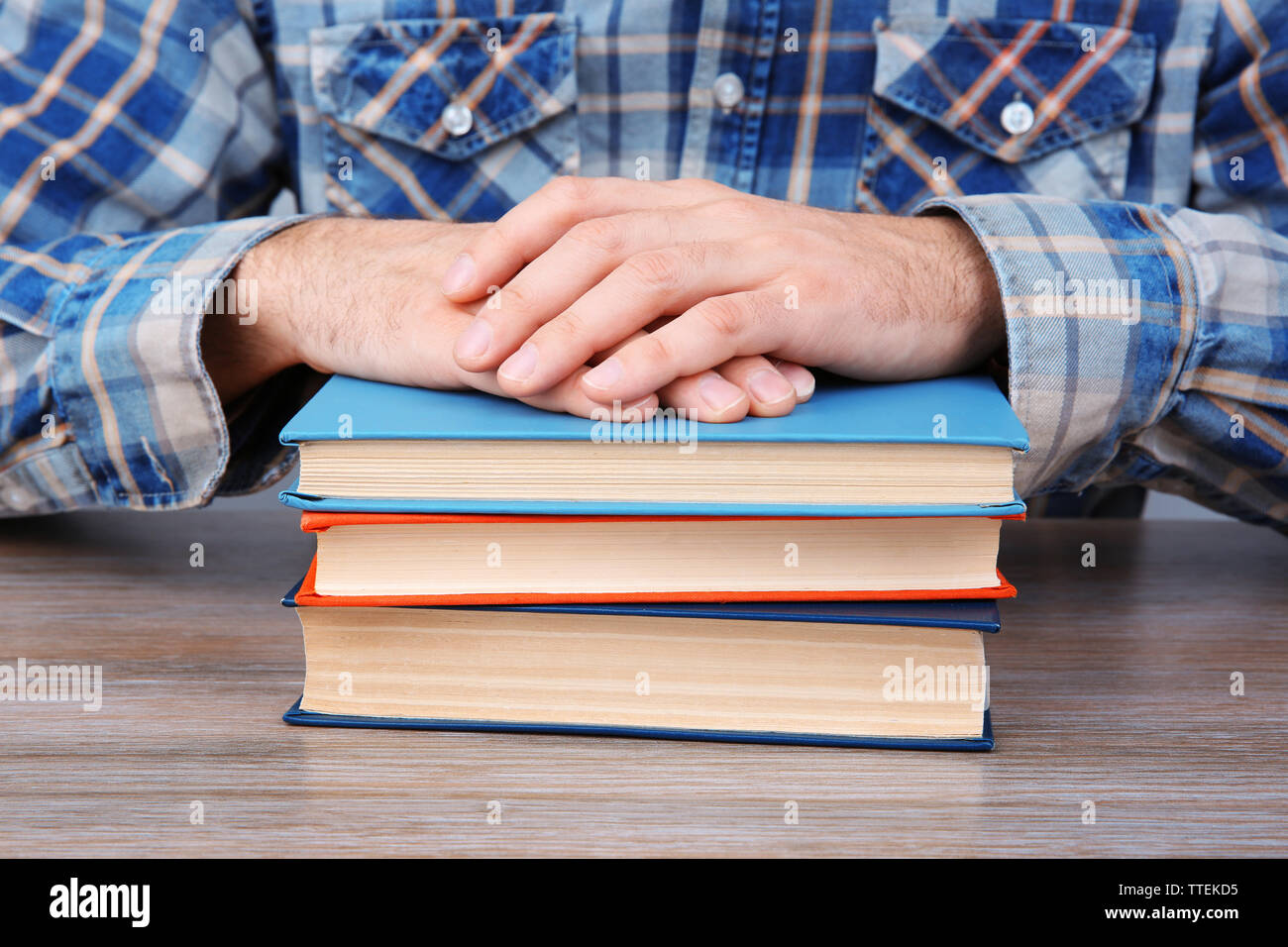 Man working with books, close up Stock Photo - Alamy