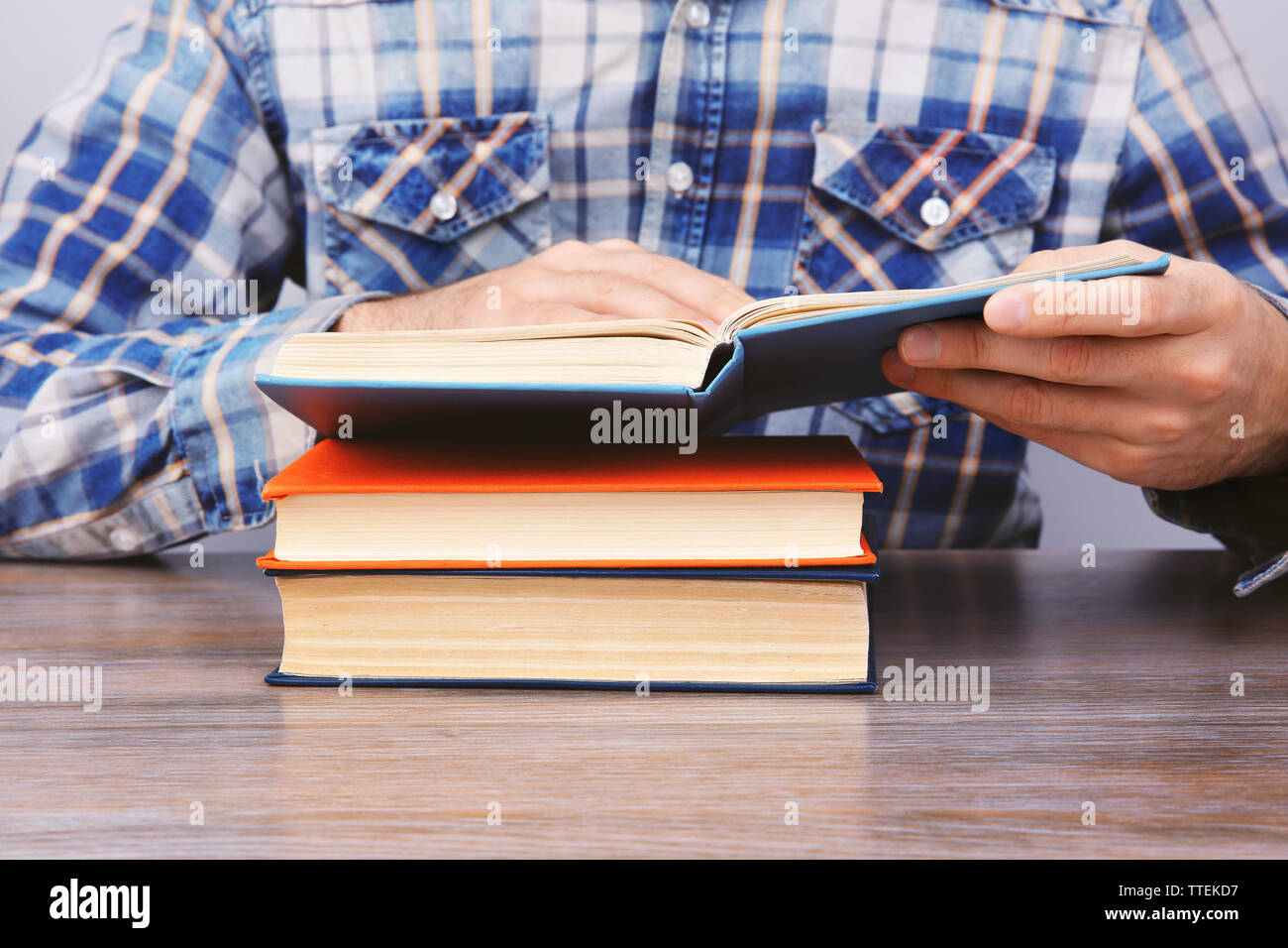 Man working with books, close up Stock Photo - Alamy