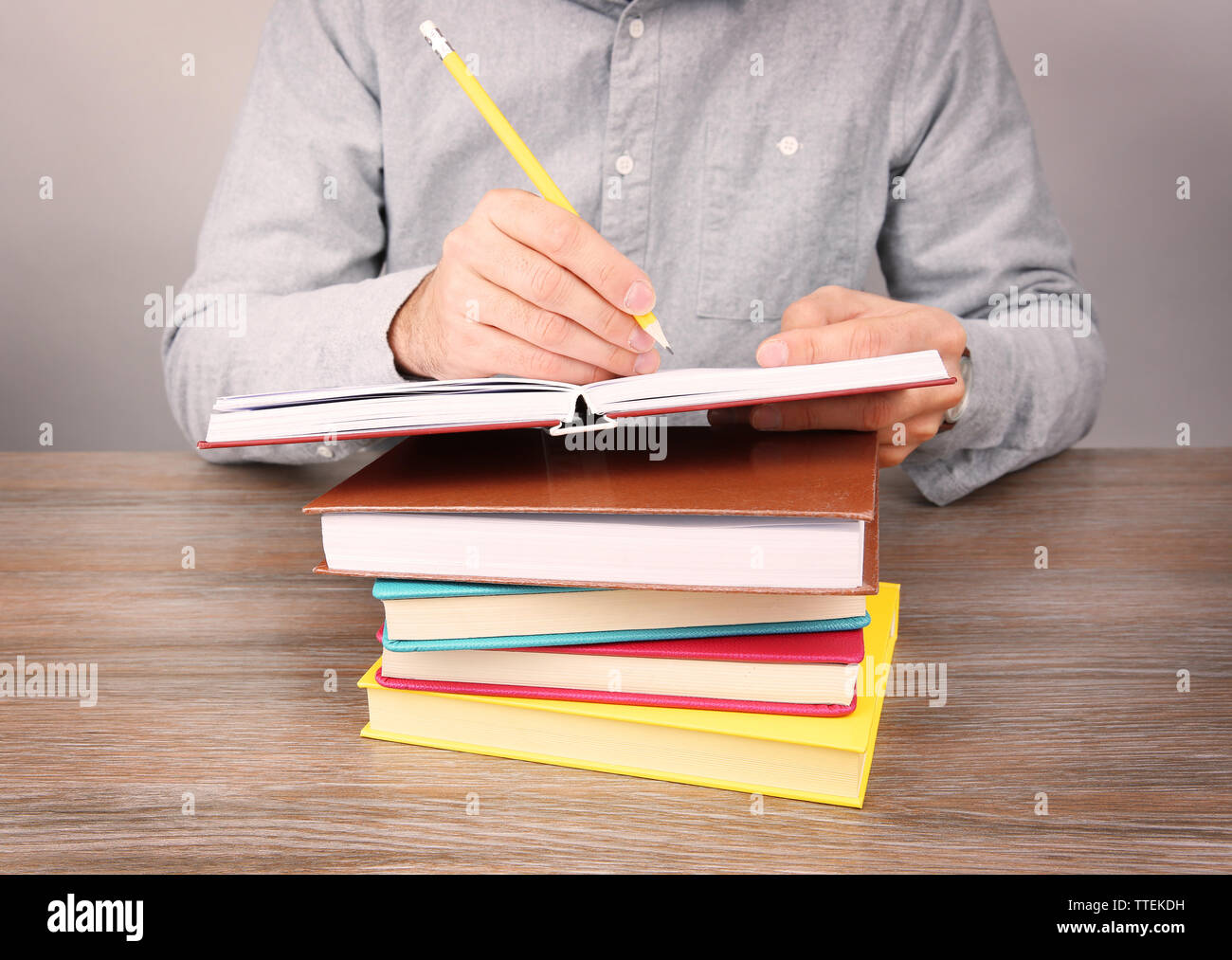 Man working with books, close up Stock Photo - Alamy