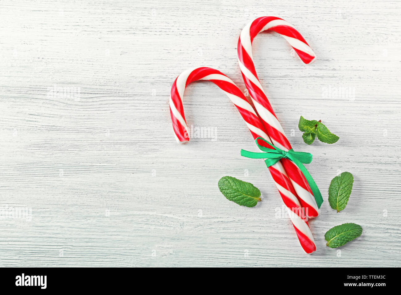 Lollipop candies with mint and stripe on light background Stock Photo ...