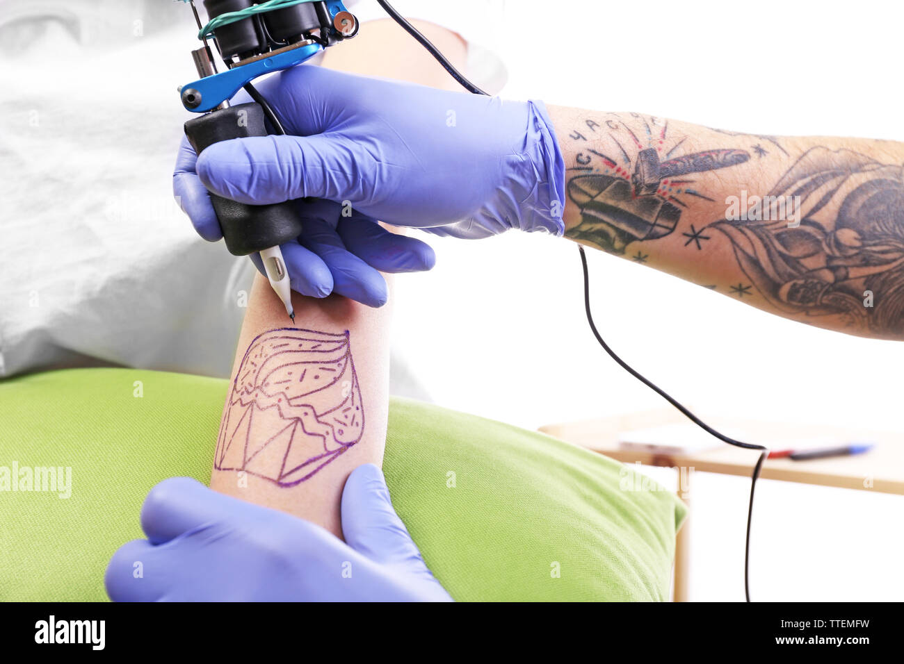 Process of making tattoo, closeup Stock Photo - Alamy
