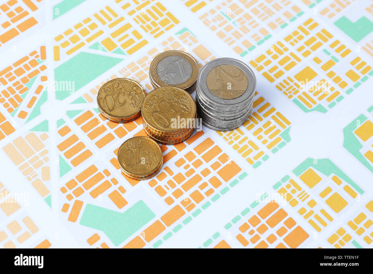 Euro coins on map background Stock Photo - Alamy
