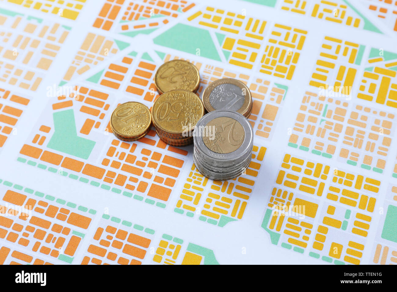 Euro coins on map background Stock Photo - Alamy