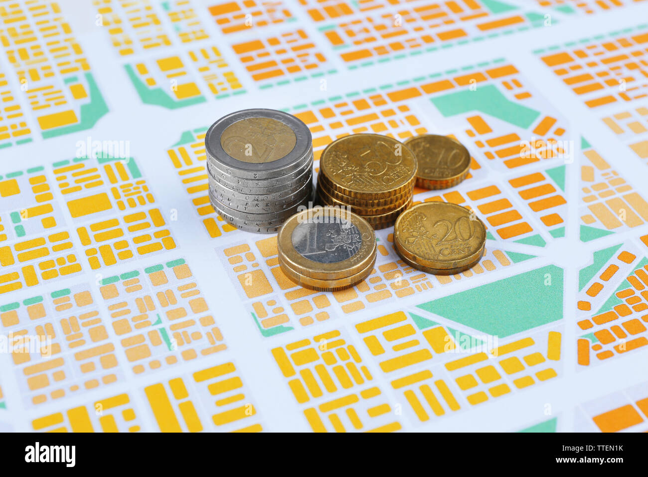 Euro coins on map background Stock Photo - Alamy