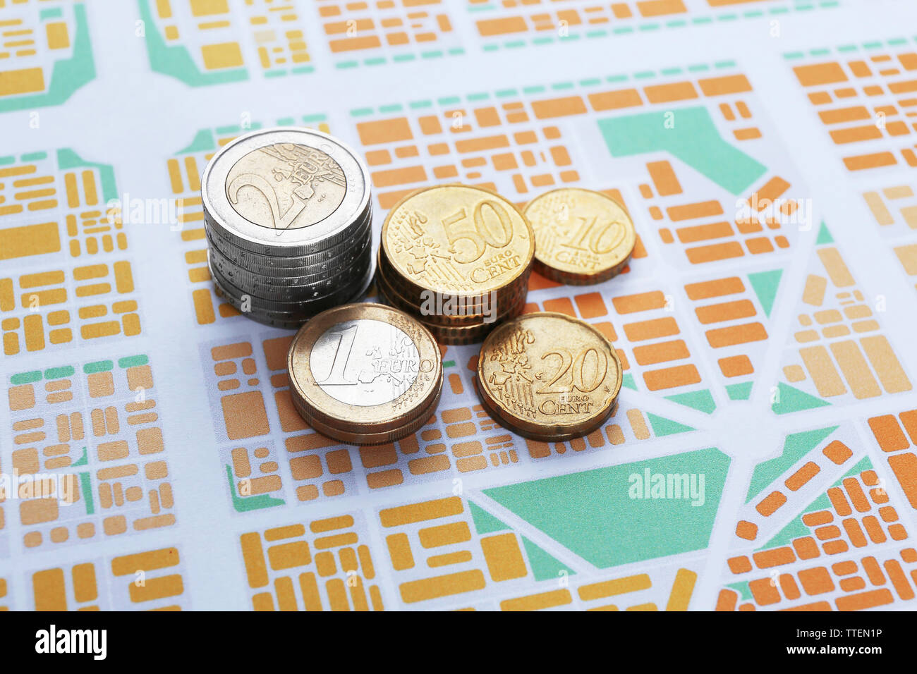 Euro coins on map background Stock Photo - Alamy