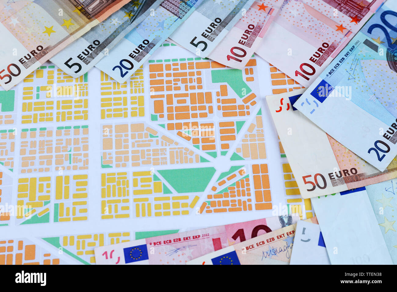 Different euro banknotes on a map background Stock Photo - Alamy