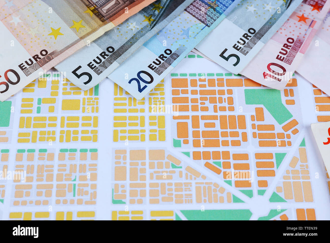 Different euro banknotes on a map background Stock Photo - Alamy