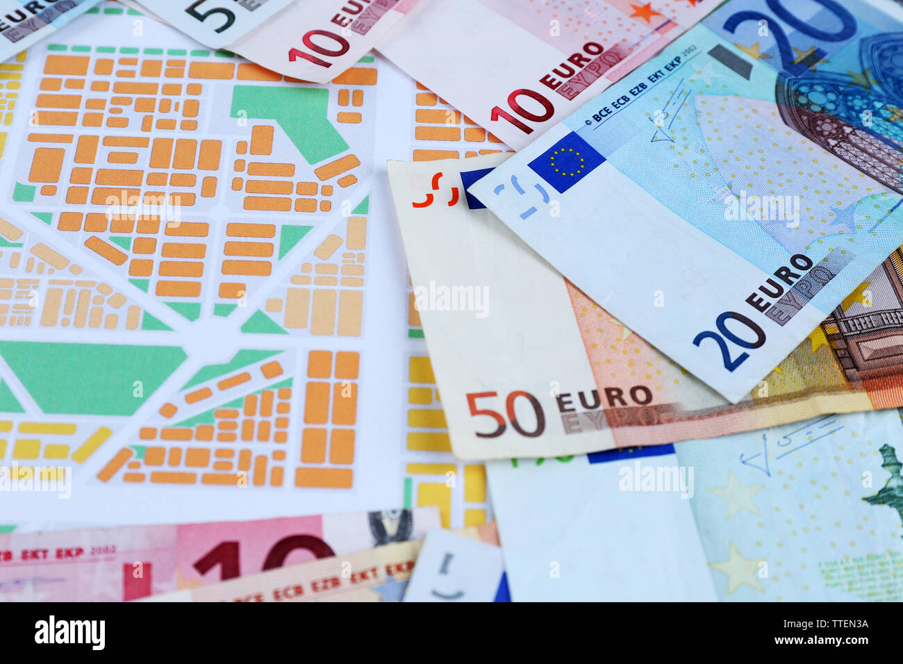 Different euro banknotes on a map background Stock Photo - Alamy