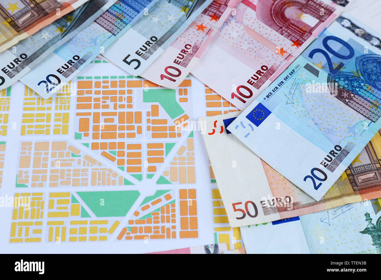 Different euro banknotes on a map background Stock Photo - Alamy