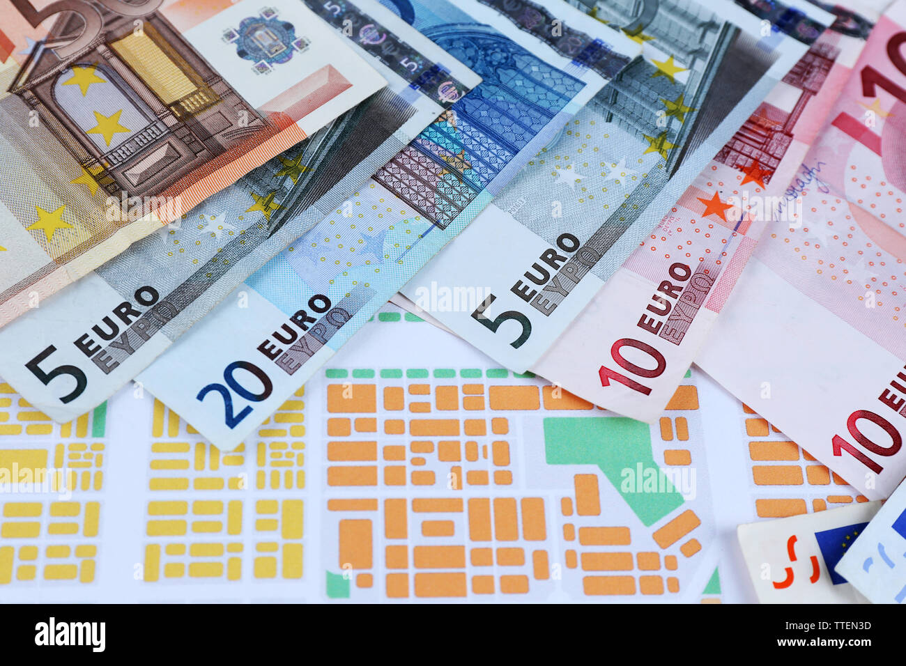 Different euro banknotes on a map background Stock Photo - Alamy