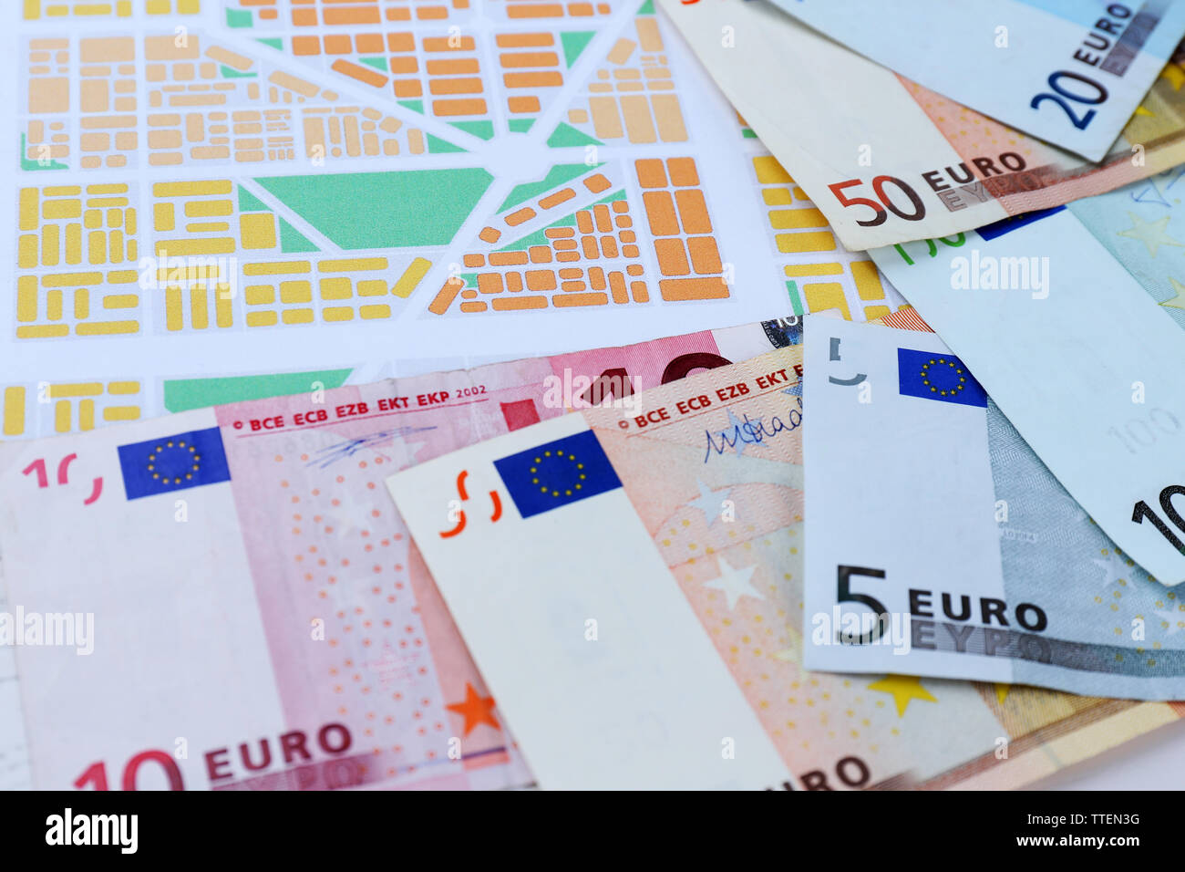 Different euro banknotes on a map background Stock Photo - Alamy