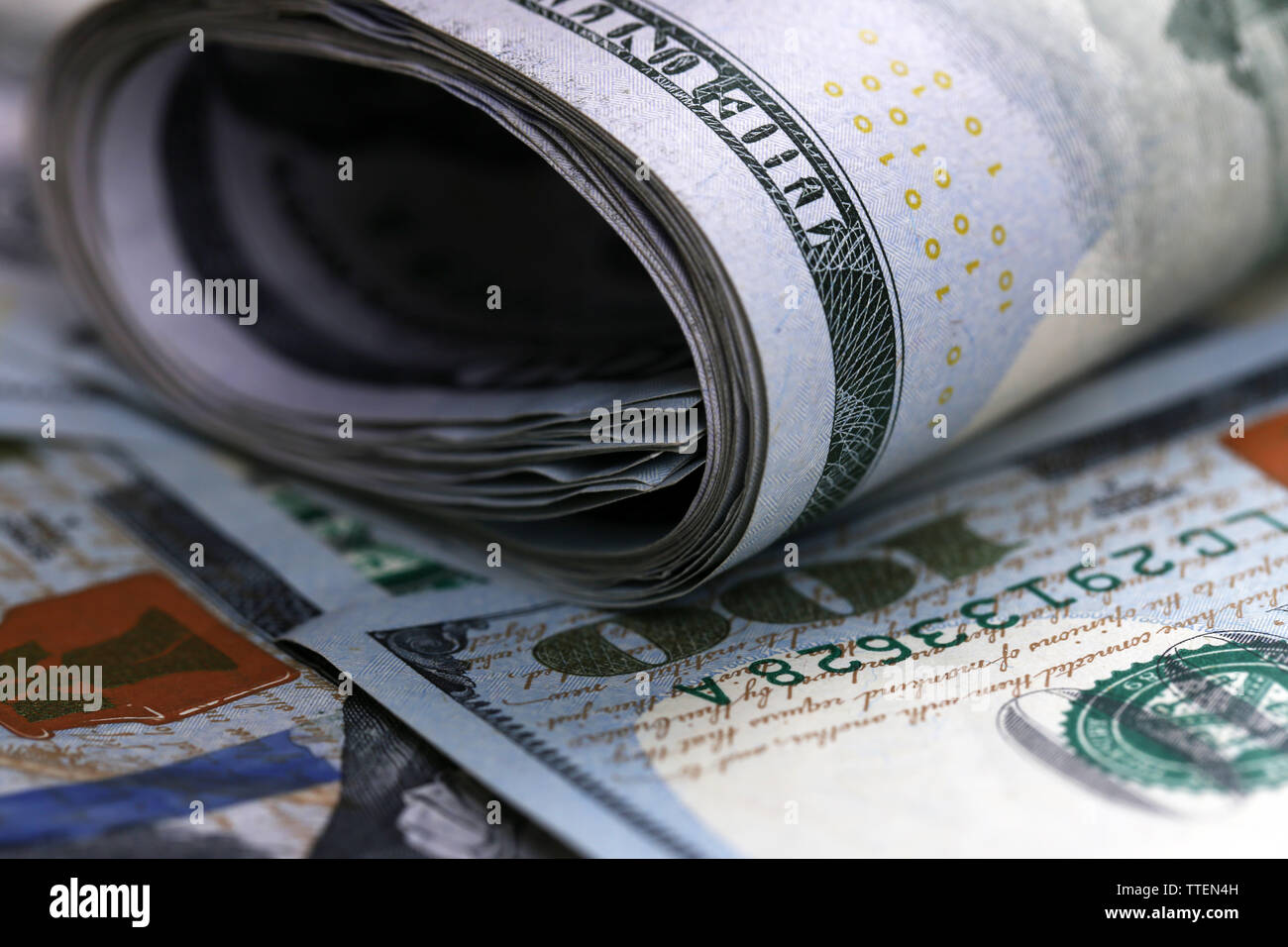Twisted dollar banknotes, close up Stock Photo - Alamy