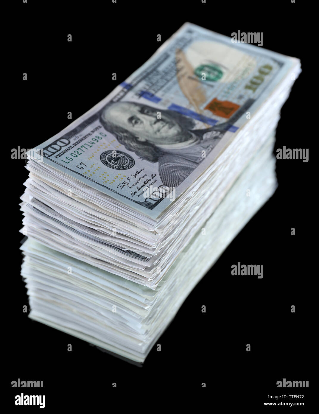 Stack of dollar banknotes on black background Stock Photo - Alamy