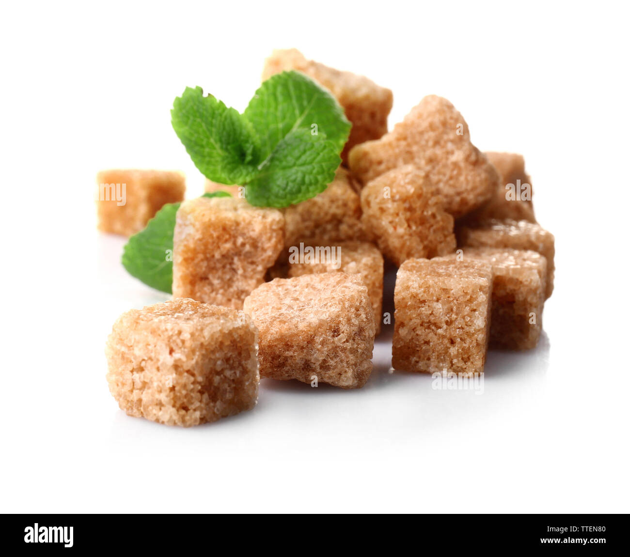 Pile of brown sugar cubes and stevia isolated on white background Stock ...