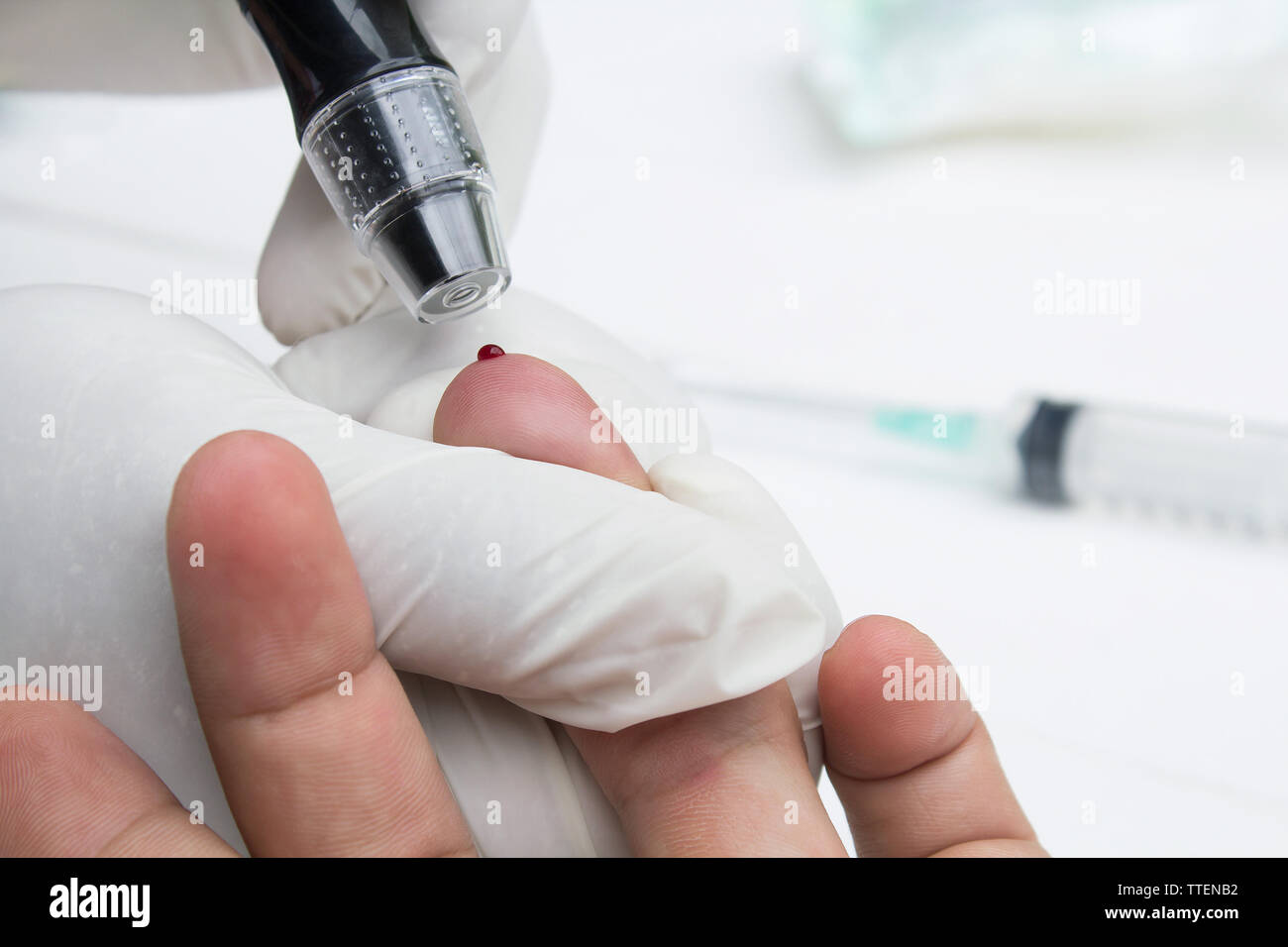Doctor bleeding patient finger for blood checking in lab Stock Photo ...