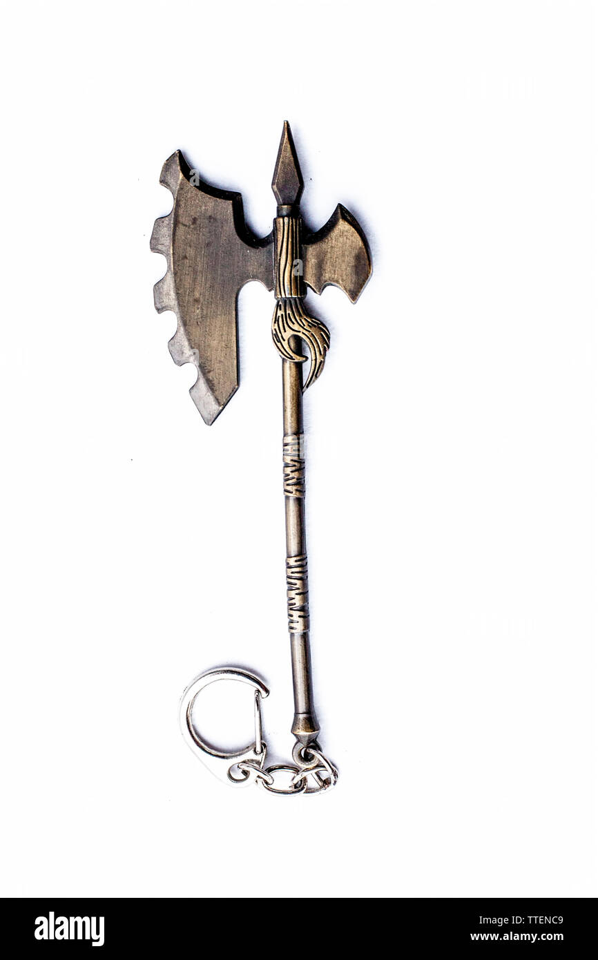 Close up of Axe key chain of golden color isolated on white Stock Photo ...
