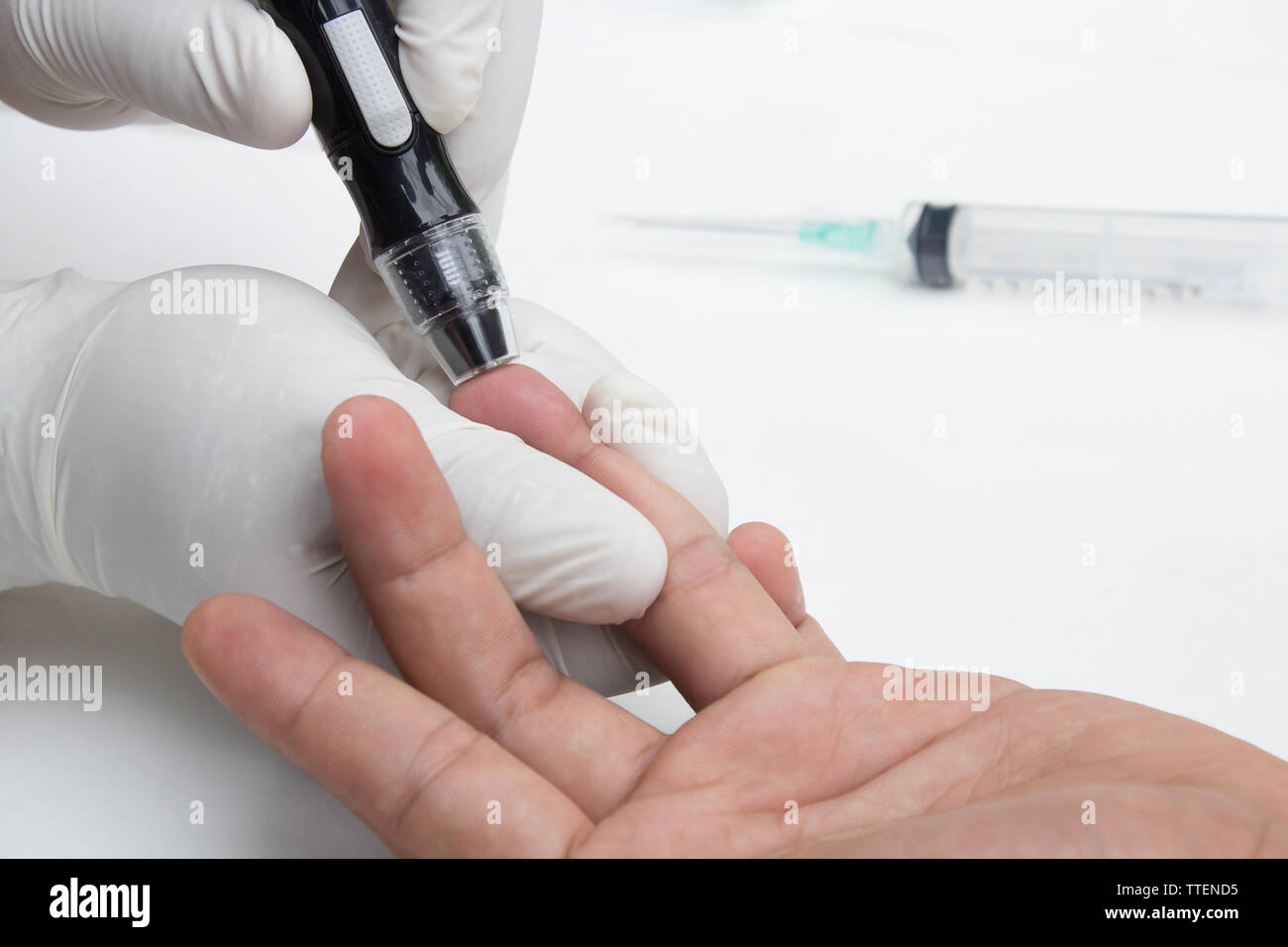 Doctor bleeding patient finger for blood checking in lab Stock Photo - Alamy