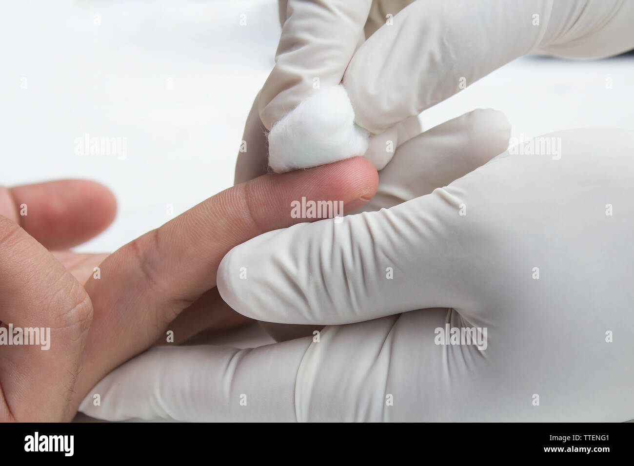 Doctor bleeding patient finger for blood checking in lab Stock Photo ...