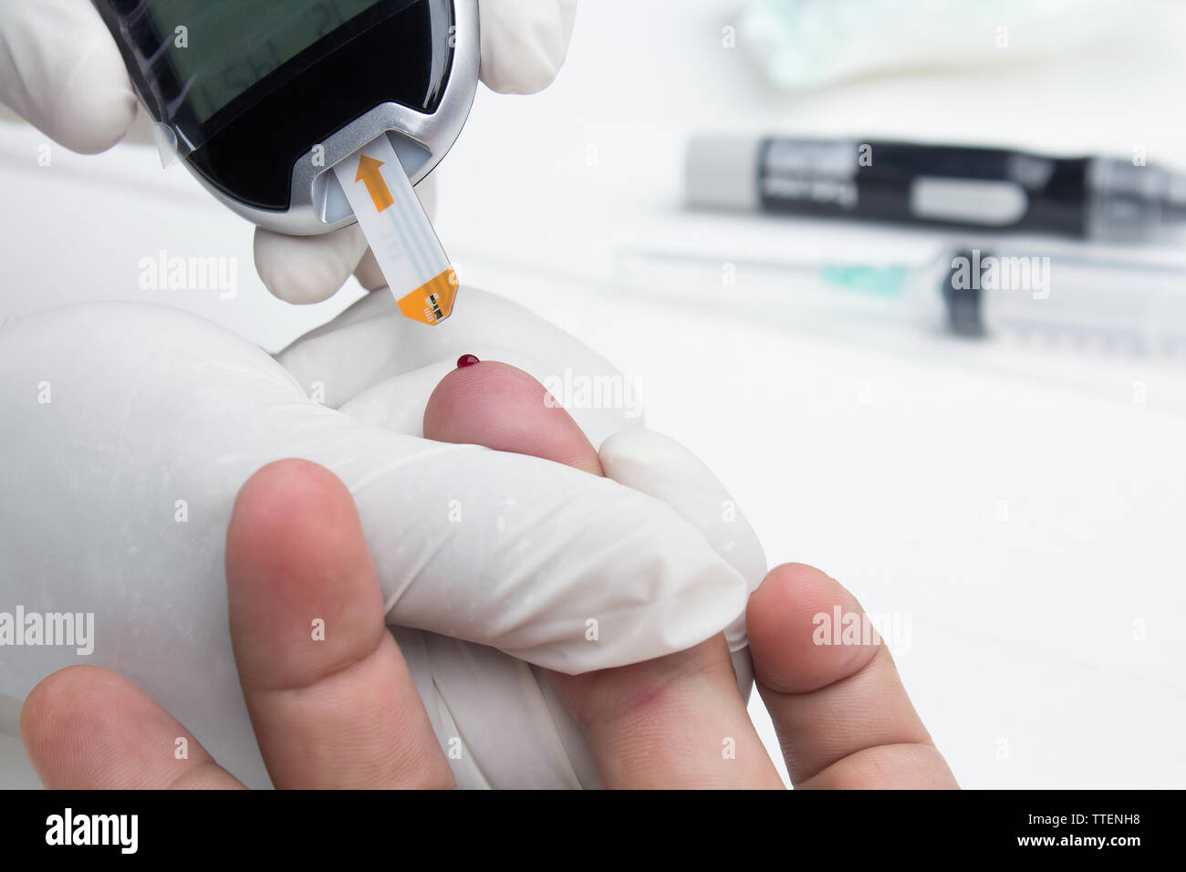 Doctor bleeding patient finger for blood checking in lab Stock Photo ...