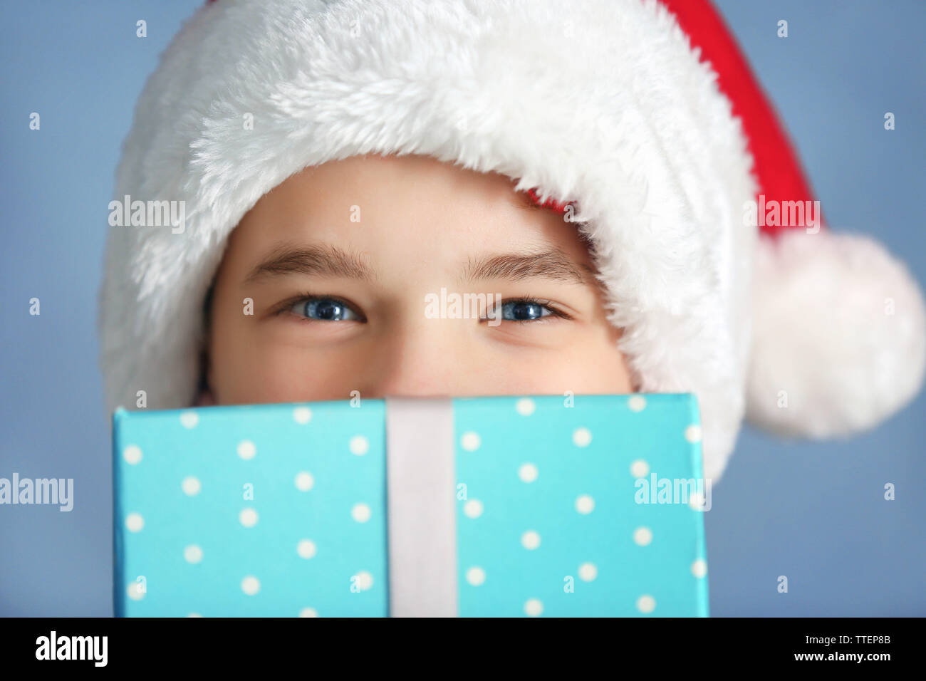 Portrait of cute boy with blue gift box, close up Stock Photo - Alamy