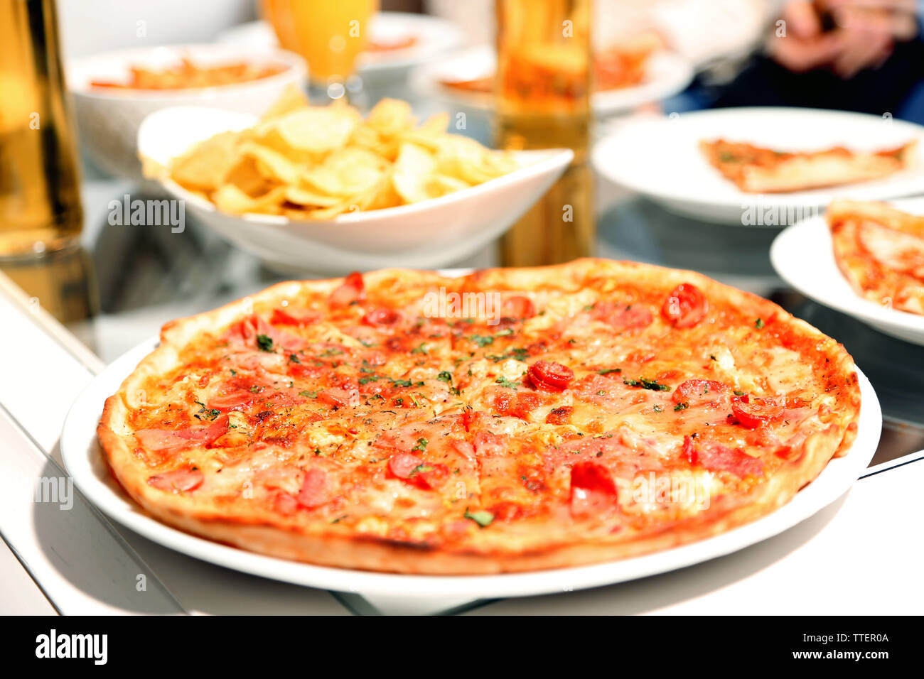 Table at home with pizza and drinks for friends Stock Photo - Alamy
