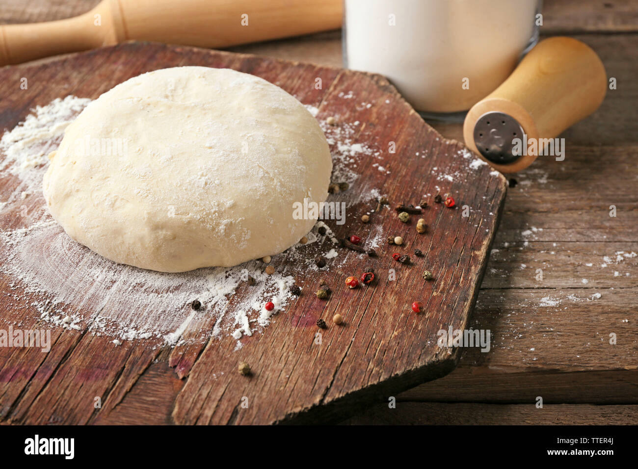 Fresh prepared dough on a wooden board, close up Stock Photo - Alamy