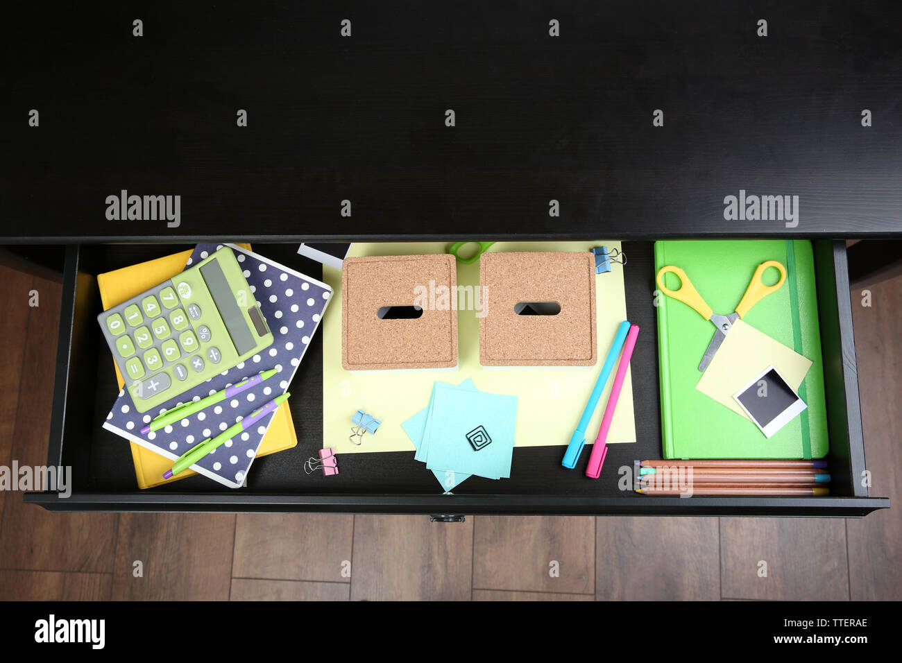 Stationery in open desk drawer, top view Stock Photo - Alamy