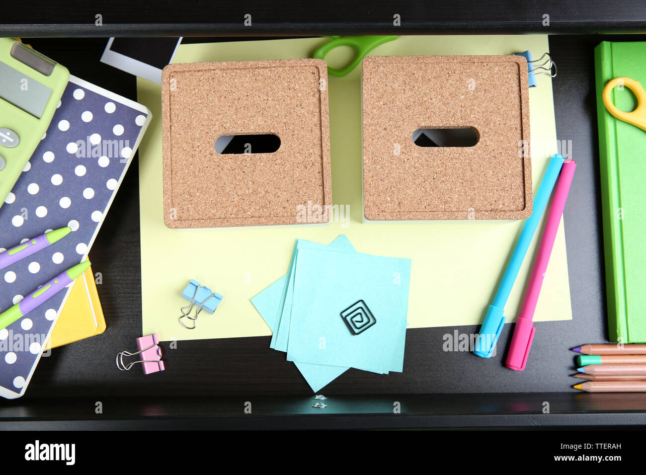 Stationery in open desk drawer, top view Stock Photo - Alamy
