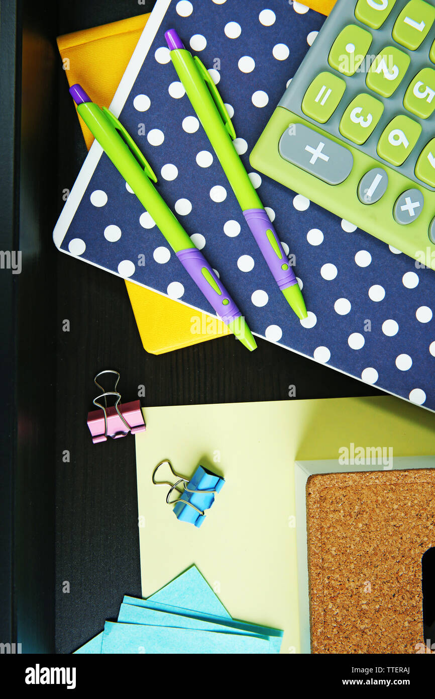 Stationery in open desk drawer, top view Stock Photo - Alamy