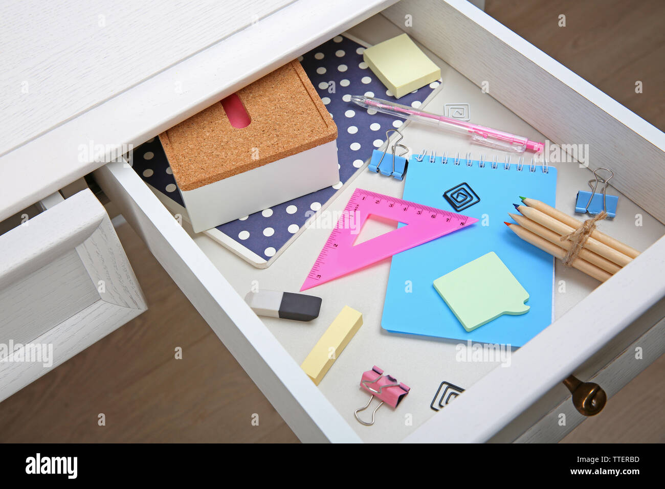 Stationery in open desk drawer closeup Stock Photo - Alamy
