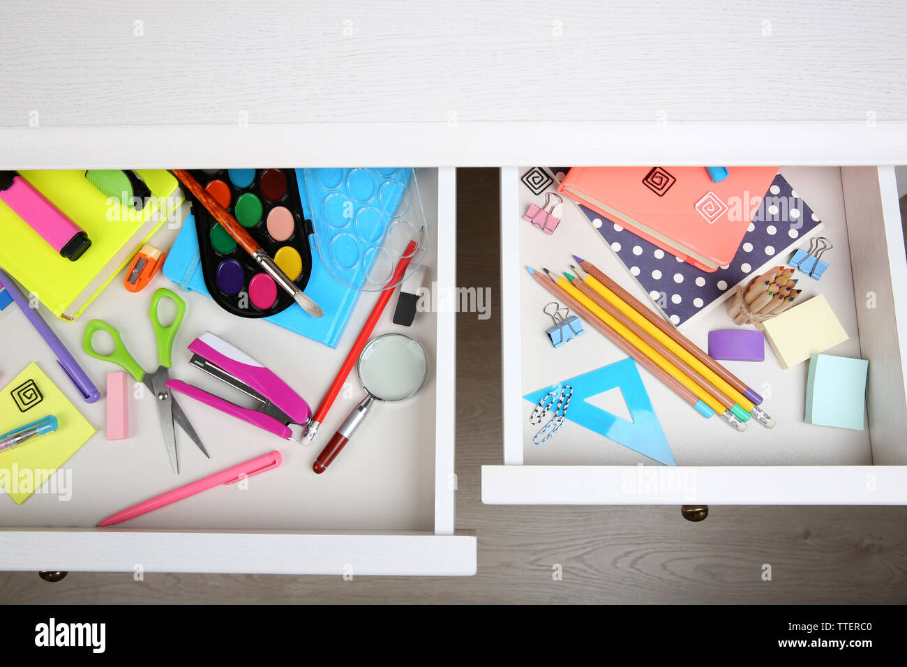 Stationery in open desk drawer closeup Stock Photo - Alamy