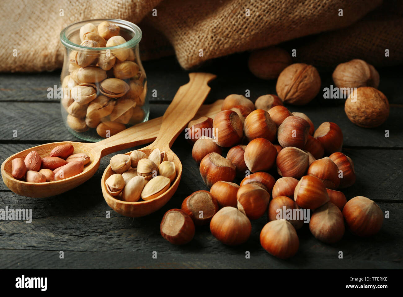 Hazelnuts, pistachios and walnuts on the table, close-up Stock Photo ...