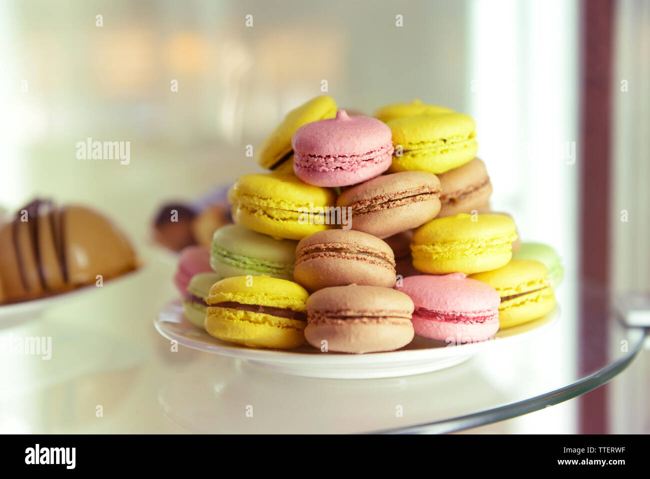 Set of colorful macaroons in plate close up Stock Photo - Alamy