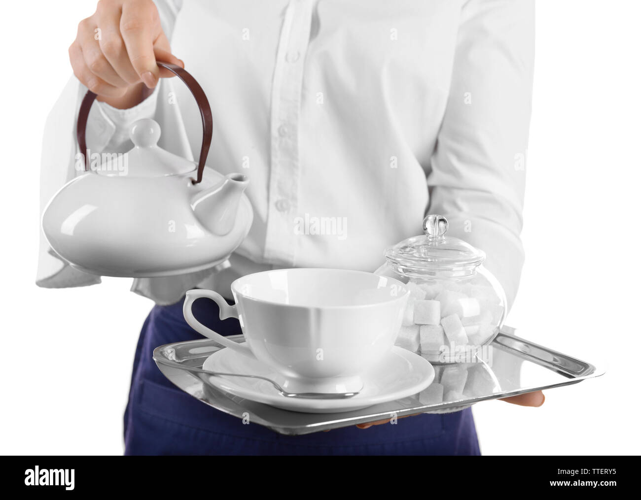 Waiter holding tray with teapot and cup on white background Stock Photo ...