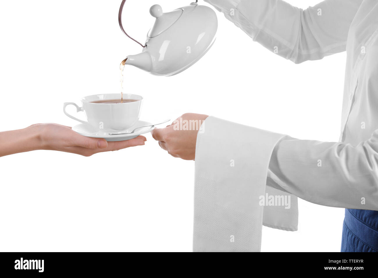 Waiter pouring tea to customer in cup isolated on white Stock Photo - Alamy