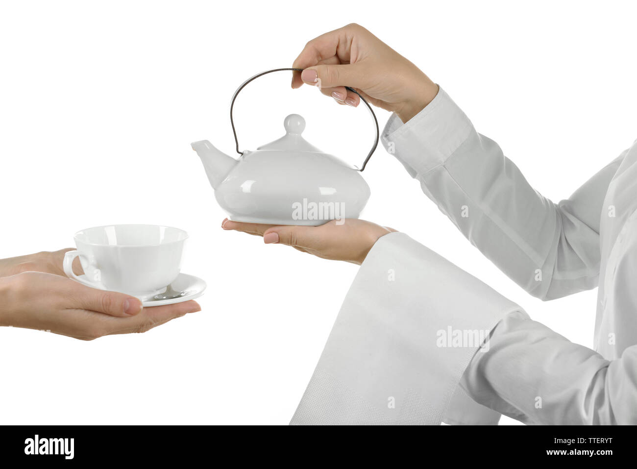 Waiter pouring tea to customer in cup isolated on white Stock Photo - Alamy